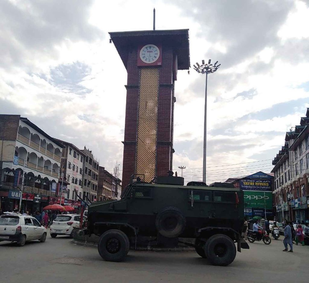 Reminiscence of 90s as armed forces cordon city center, check phones ...